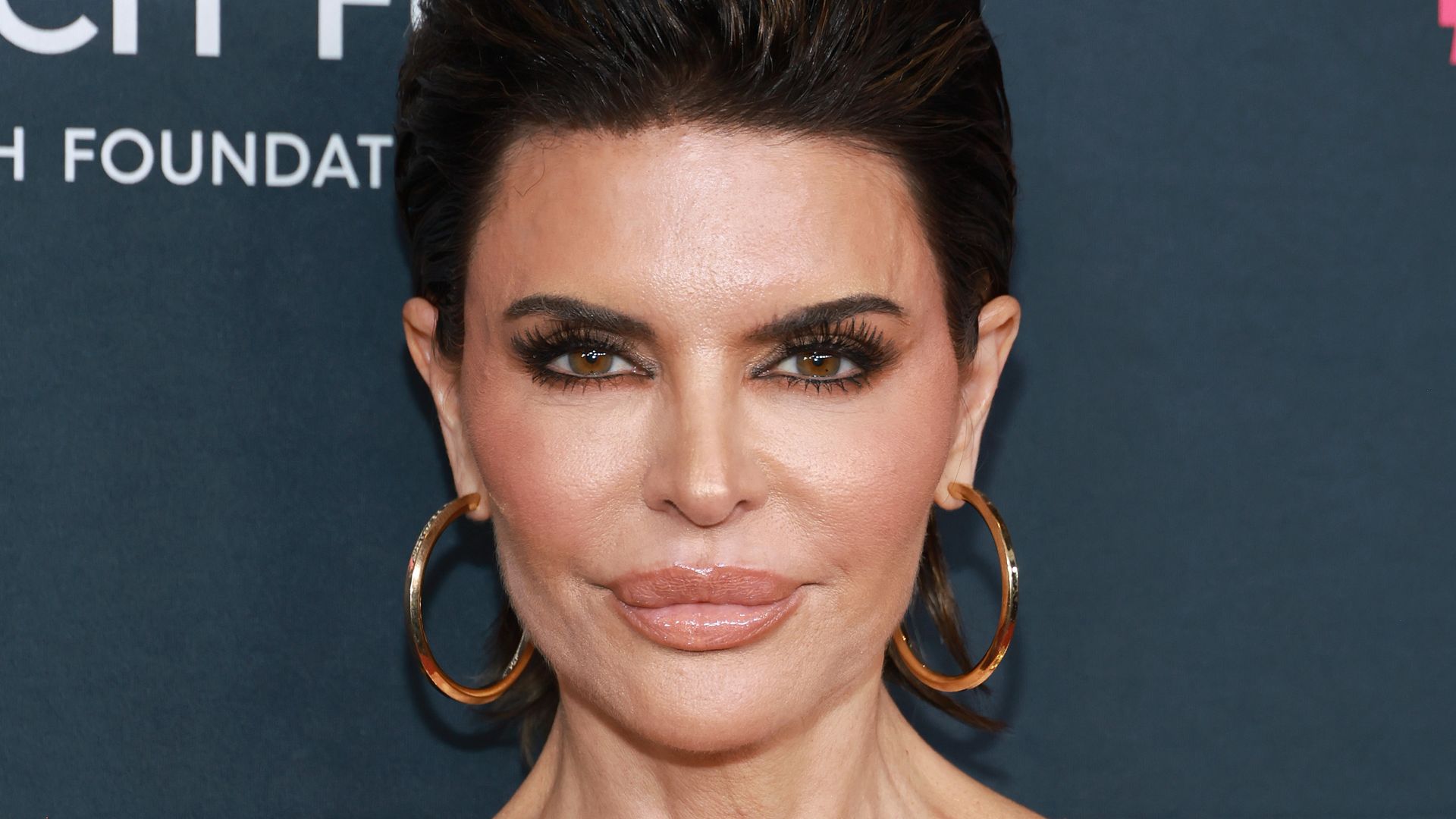 Lisa Rinna, 59, puts on a leggy display in seriously plunging playsuit ...