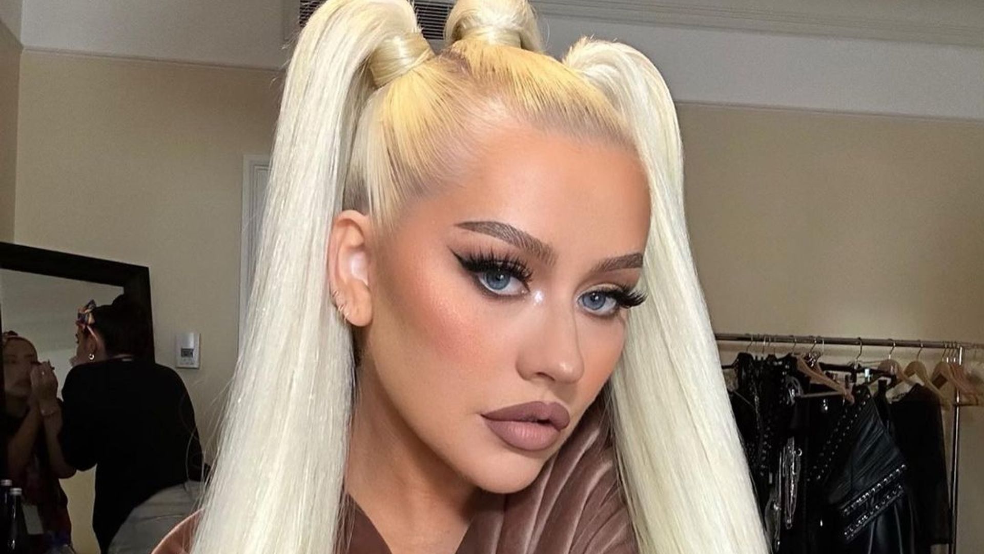 Christina Aguilera's lookalike daughter, 9, almost towers over her in ...