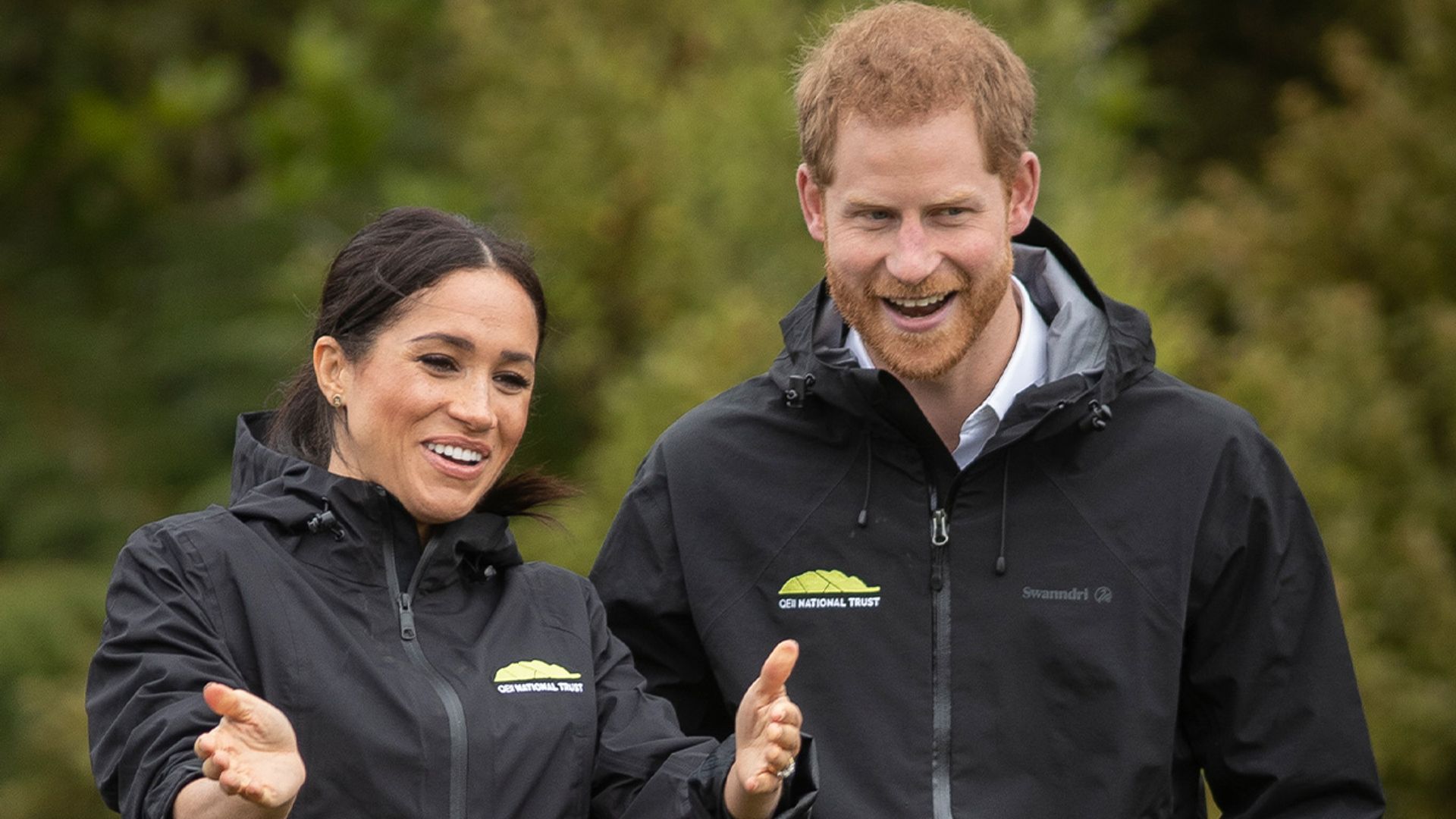 Prince Archie adorably clings to his father Prince Harry's legs in ...