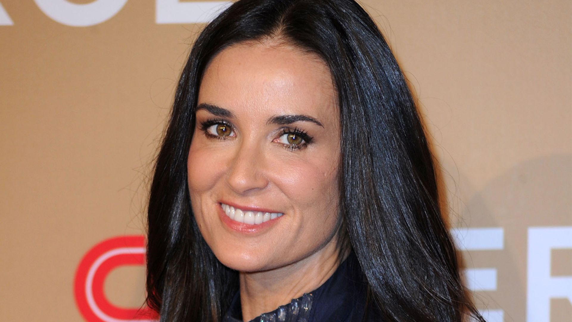 Demi Moore sizzles in buttoned-down white shirt and heels in jaw ...