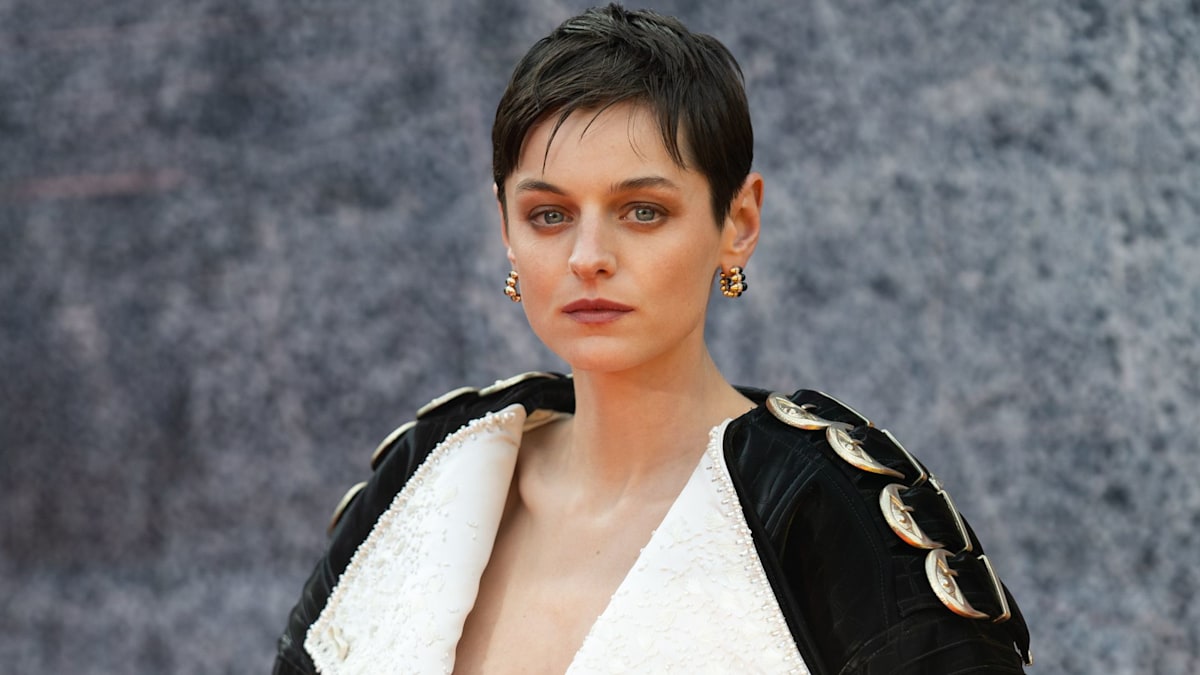 Emma Corrin looks oh-so haute in daring belted Schiaparelli suit | HELLO!