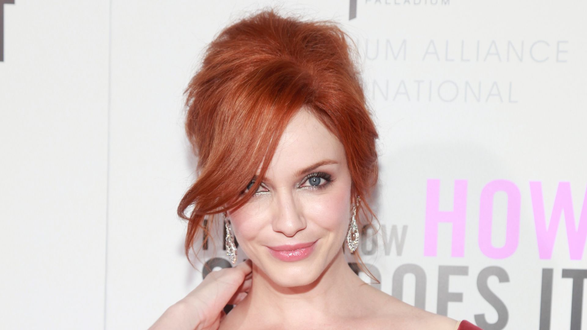 Christina Hendricks barely contains herself in tiny corset in jaw ...