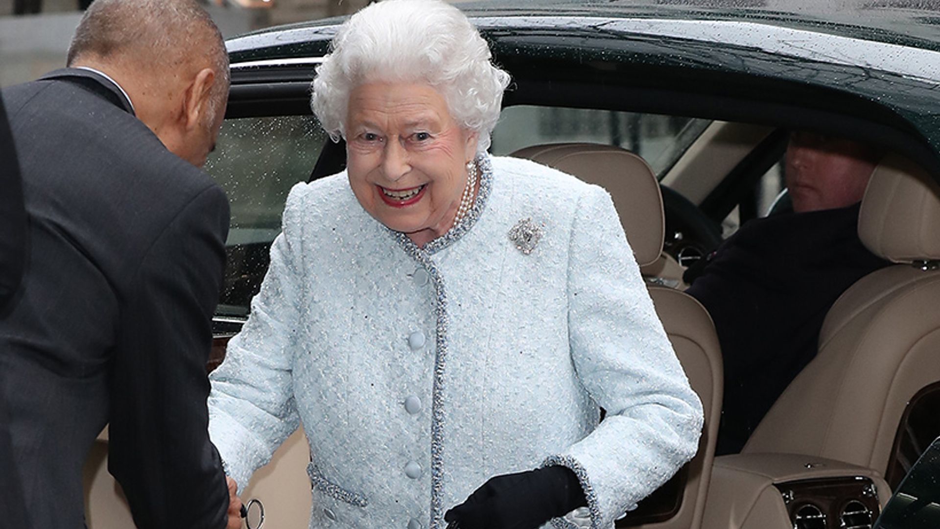 The Queen surprises in striking dress and gold handbag | HELLO!