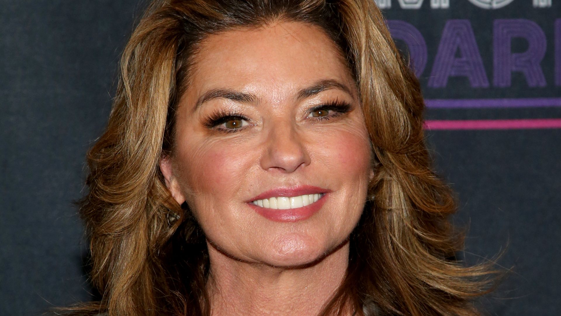 Shania Twain is a bombshell in tiny white mini skirt and sheer crop top ...