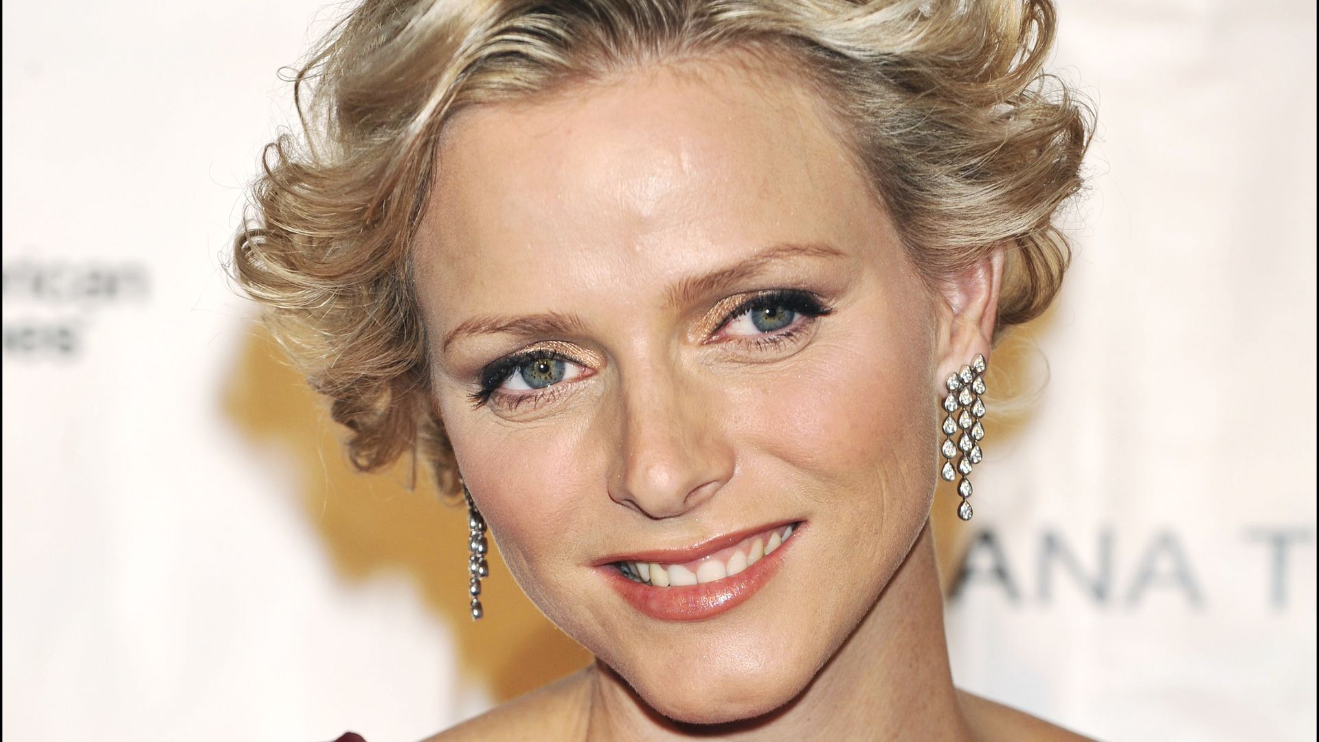 Princess Charlene resembles a Hollywood movie star in vampy red one ...