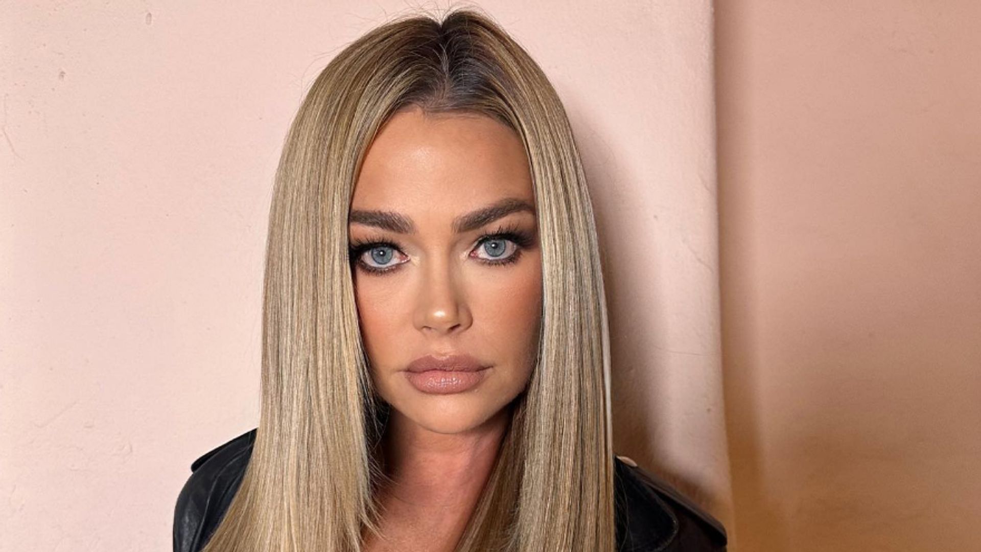 Denise Richards braves the New York rain in tiny mini dress and heels ...