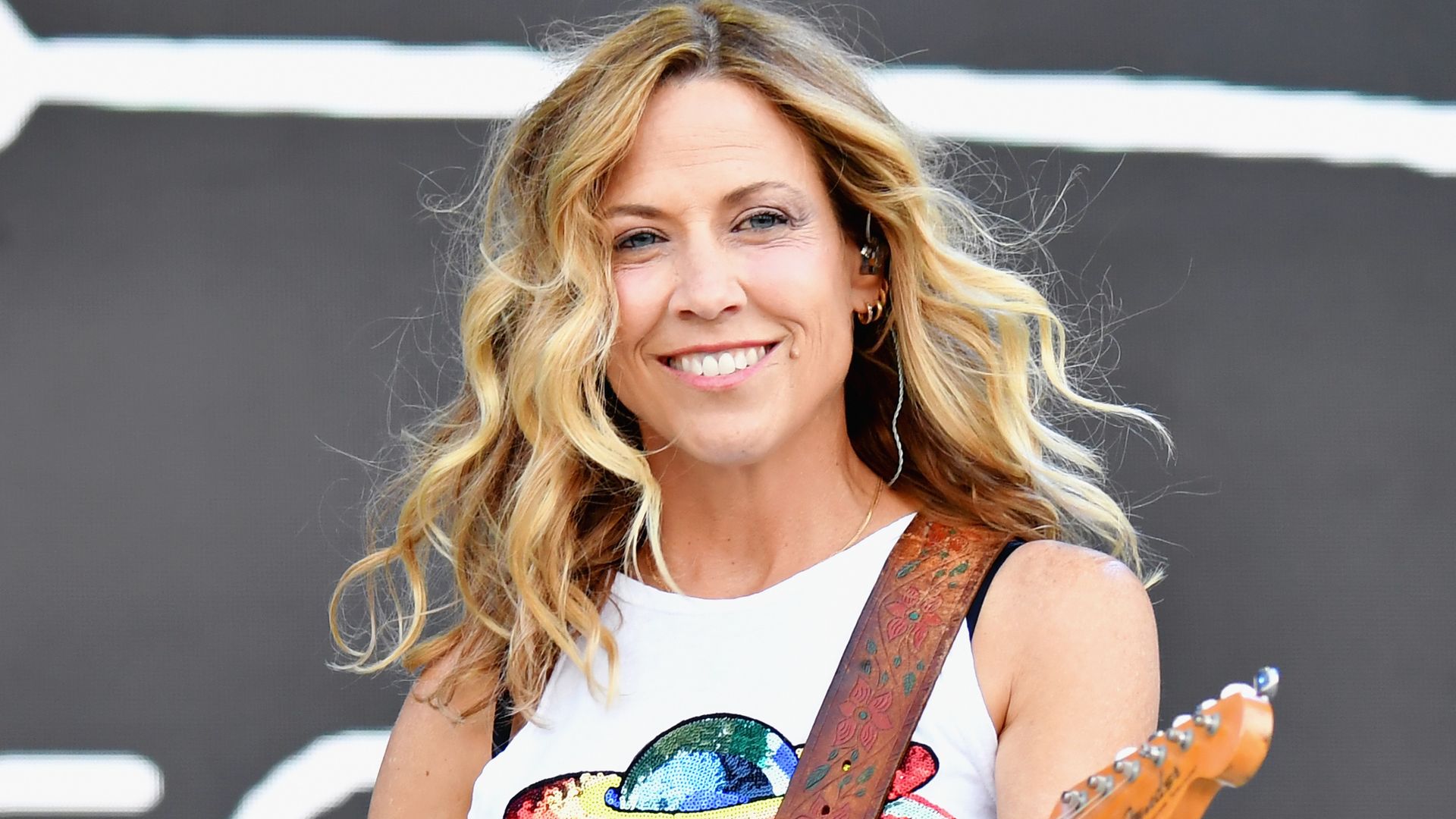 Sheryl Crow, 61, channels rock and roll in snakeskin look as she makes ...