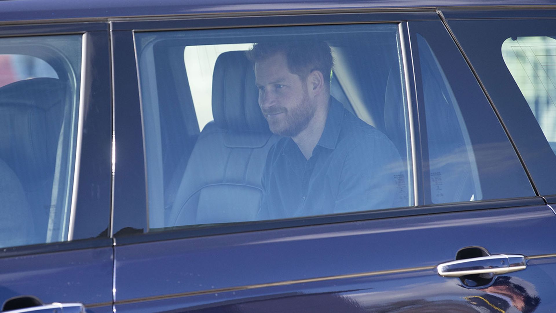 Prince Harry wears black face mask as he is pictured arriving in the UK ...