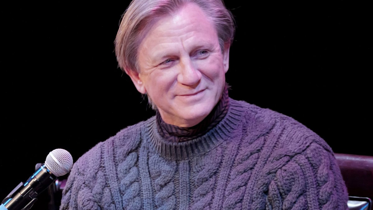Daniel Craig surprises in cable knit sweater and slippers as he ...