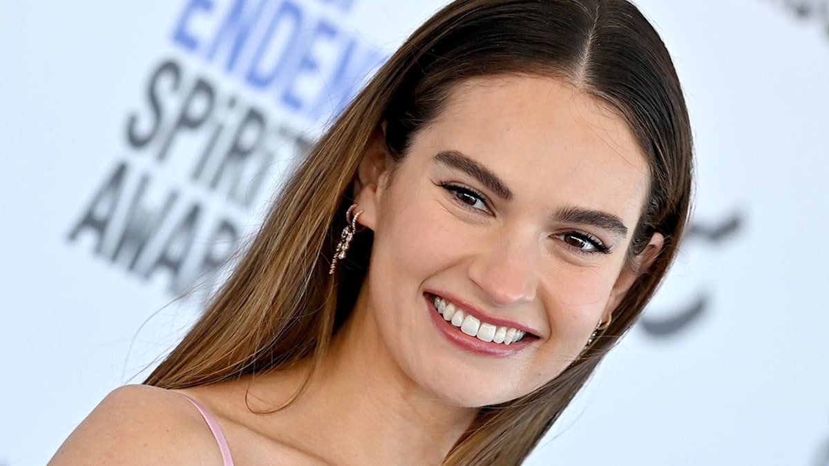 Lily James ups the ante in figure-skimming dress and heeled boots | HELLO!