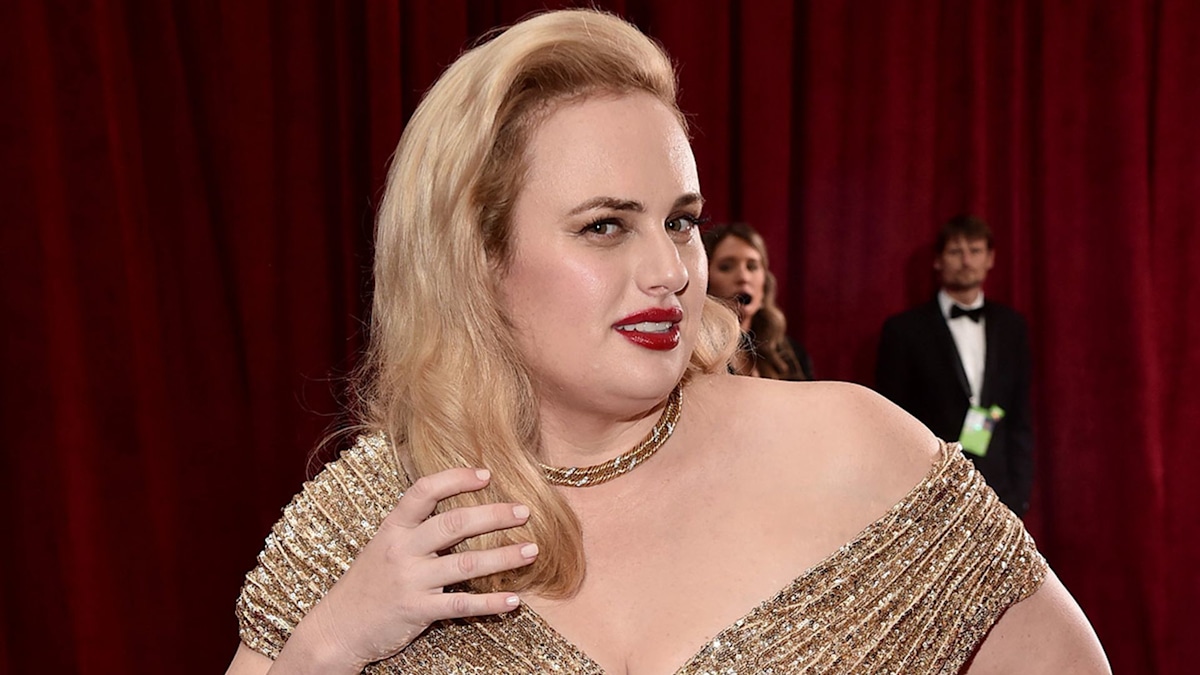 Rebel Wilson is a total beach babe in slinky black swimsuit | HELLO!