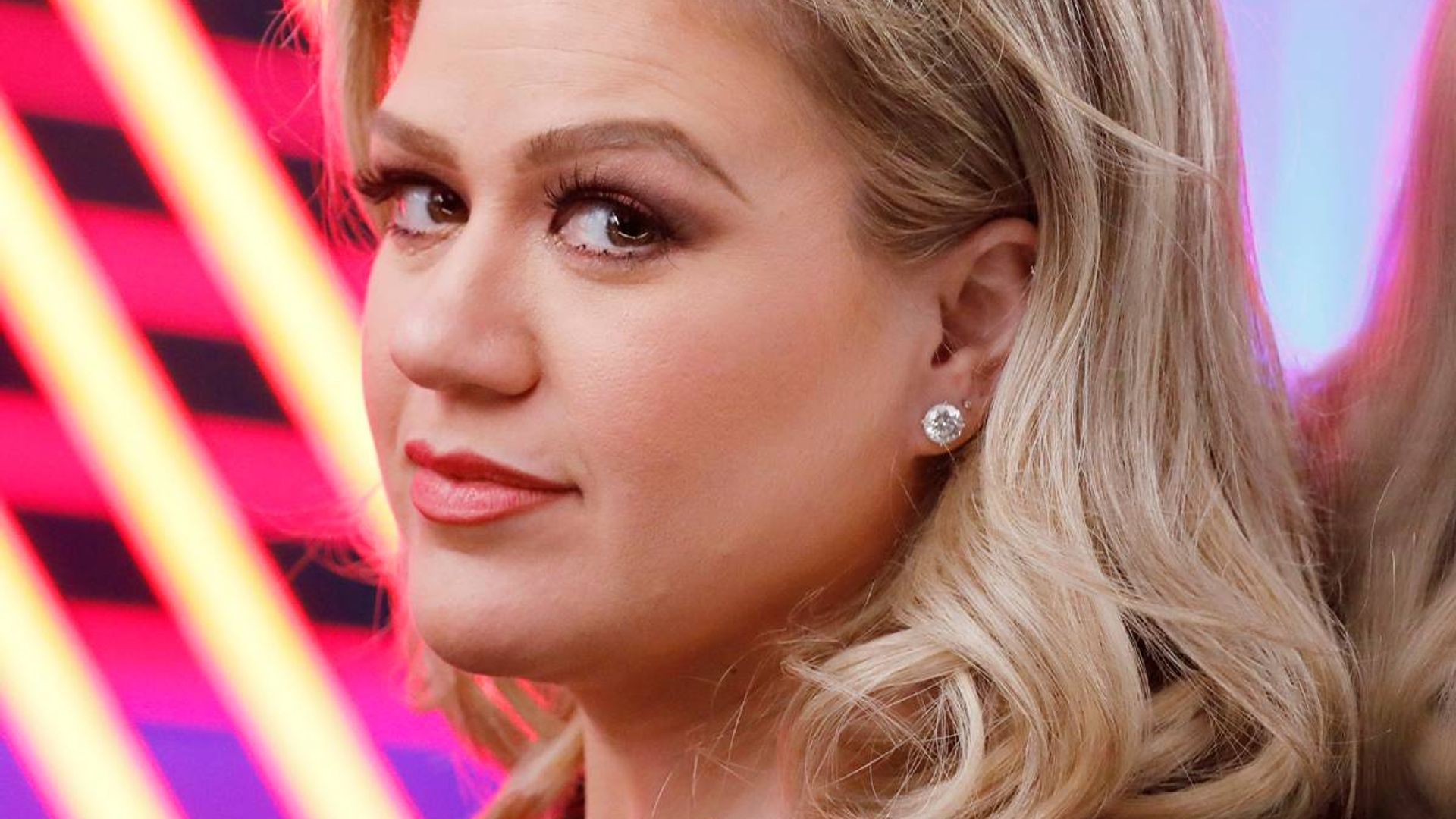 The Voice star Kelly Clarkson causes a stir in zip-up mini dress ...