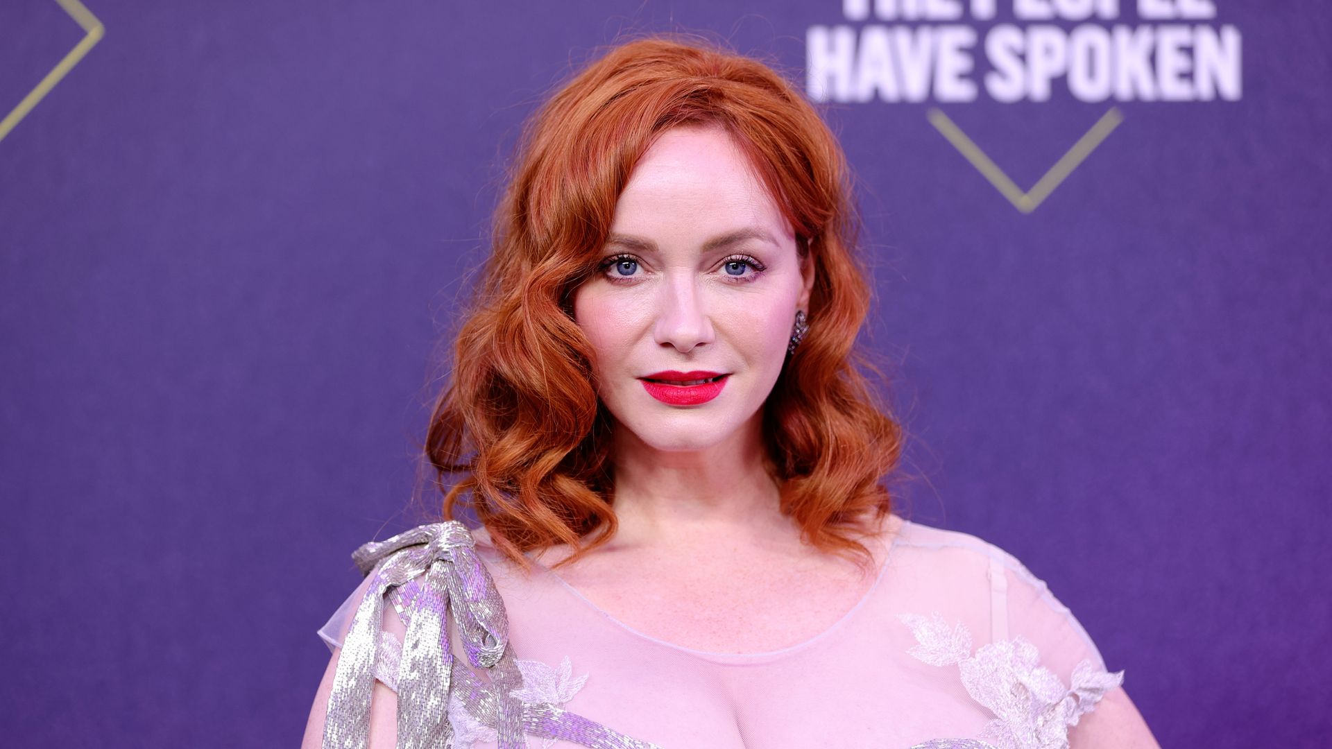 Christina Hendricks appears in deeply plunging dress as she shares ...