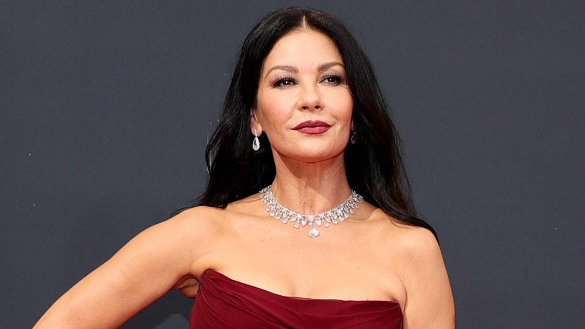 Catherine Zeta-Jones, 53, reclines in sheer thigh-skimming sundress ...
