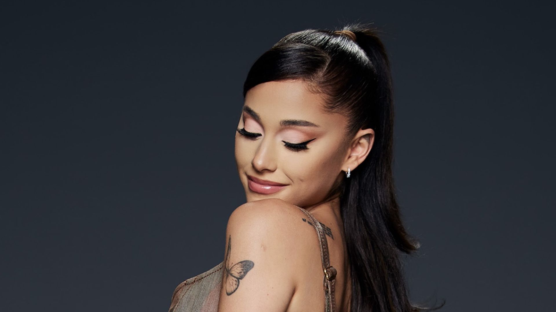 Ariana Grande spices it up in a cone bra and high slit skirt for grand return to beloved show ...