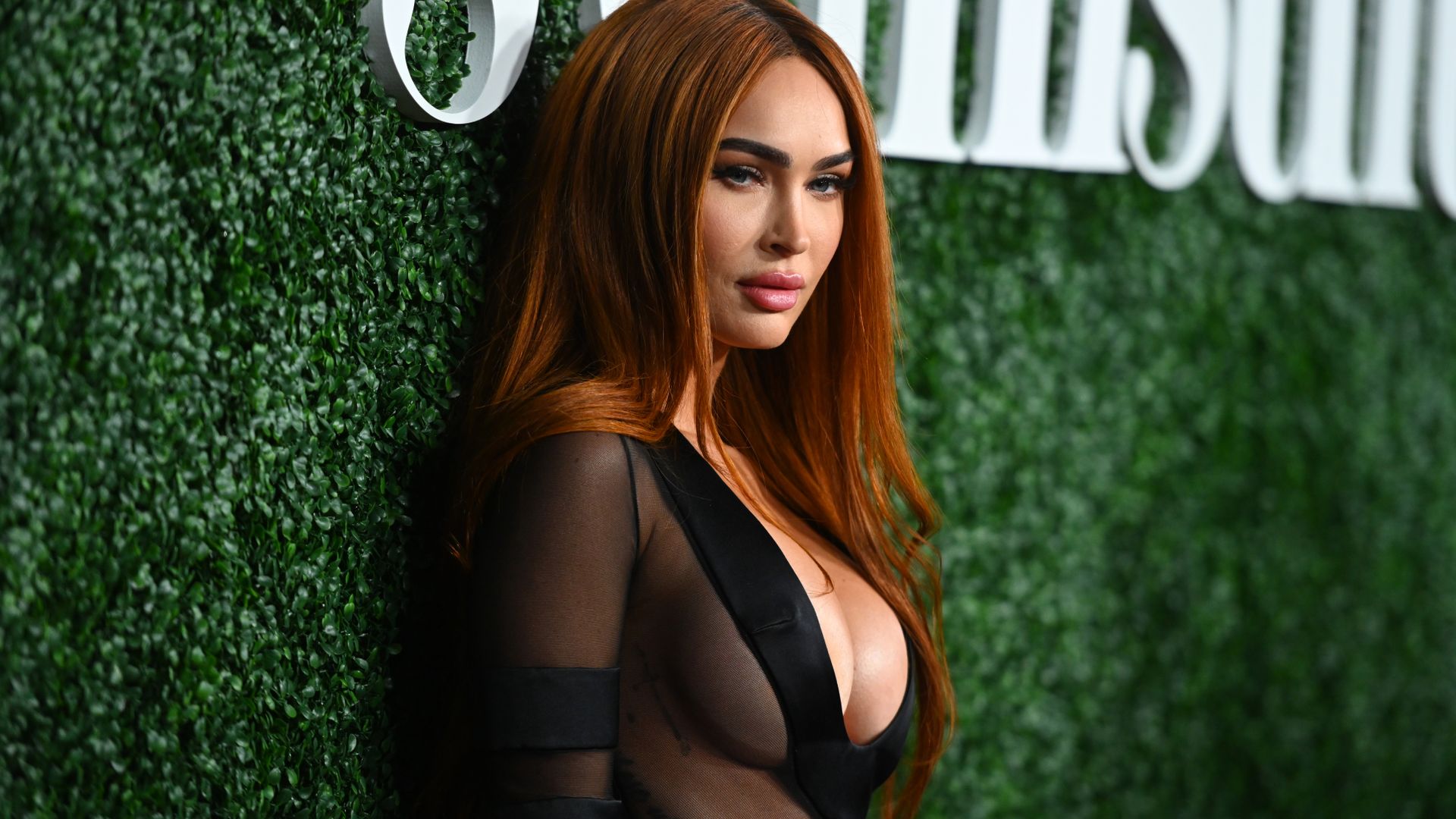 Megan Fox turns heads in low cut see-through dress as she steps out with Machine Gun Kelly amid ...