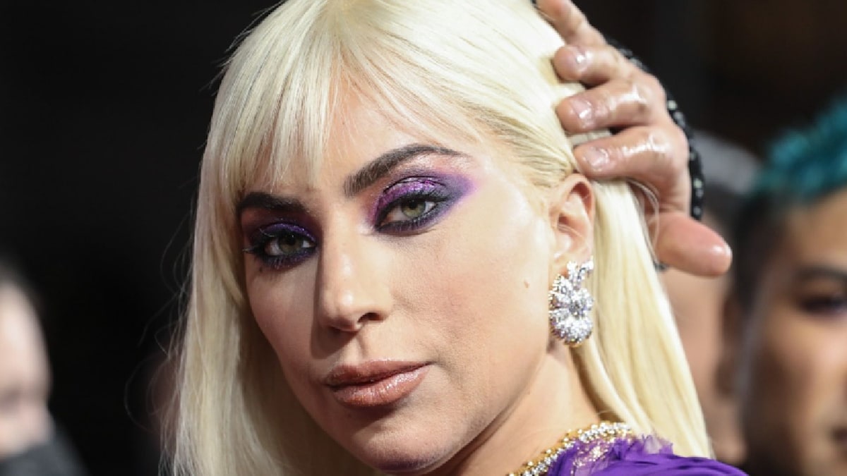 Lady Gaga wows in figure-hugging metallic dress as she unveils bold new ...
