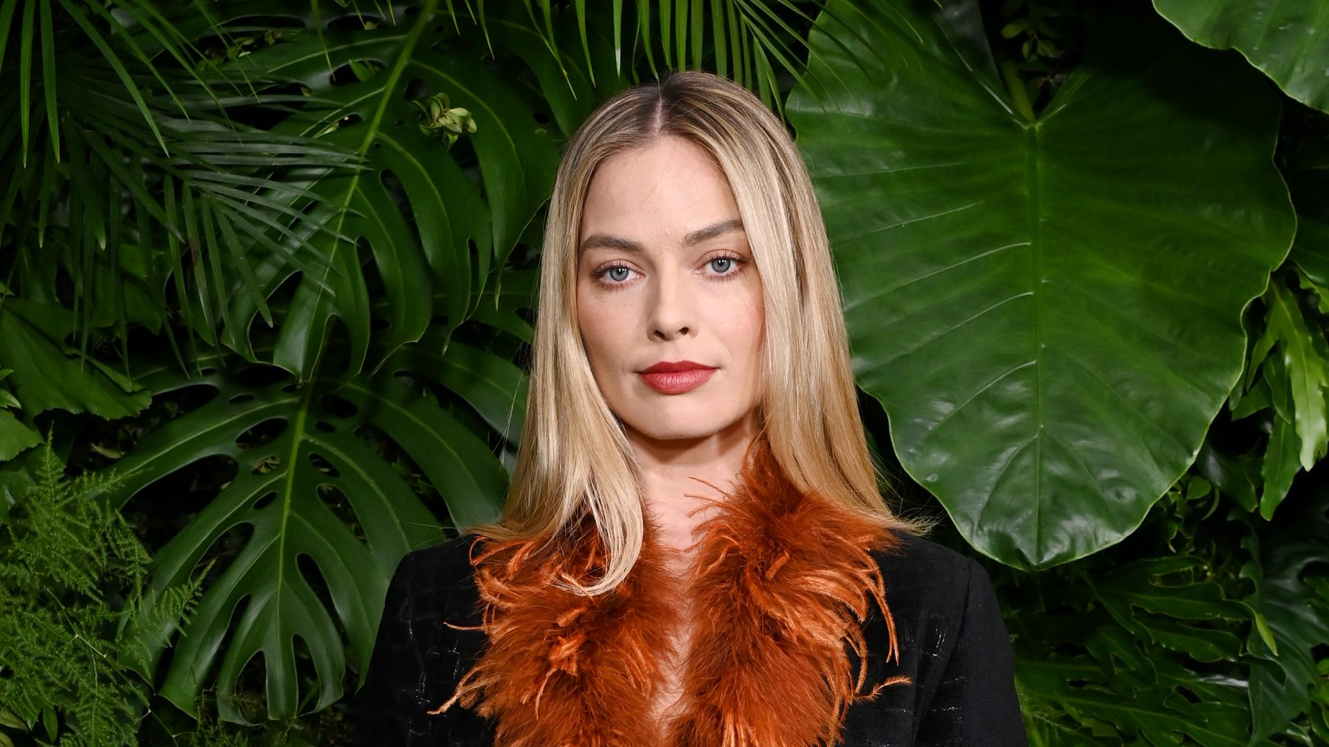 Margot Robbie rocks wild feathered mini dress and poker straight hair | HELLO!