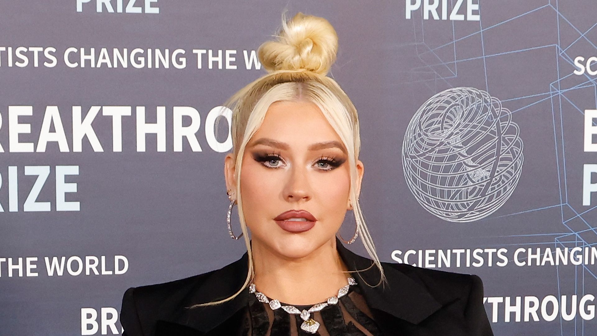 Christina Aguilera dons daring sheer jumpsuit for appearance with ...