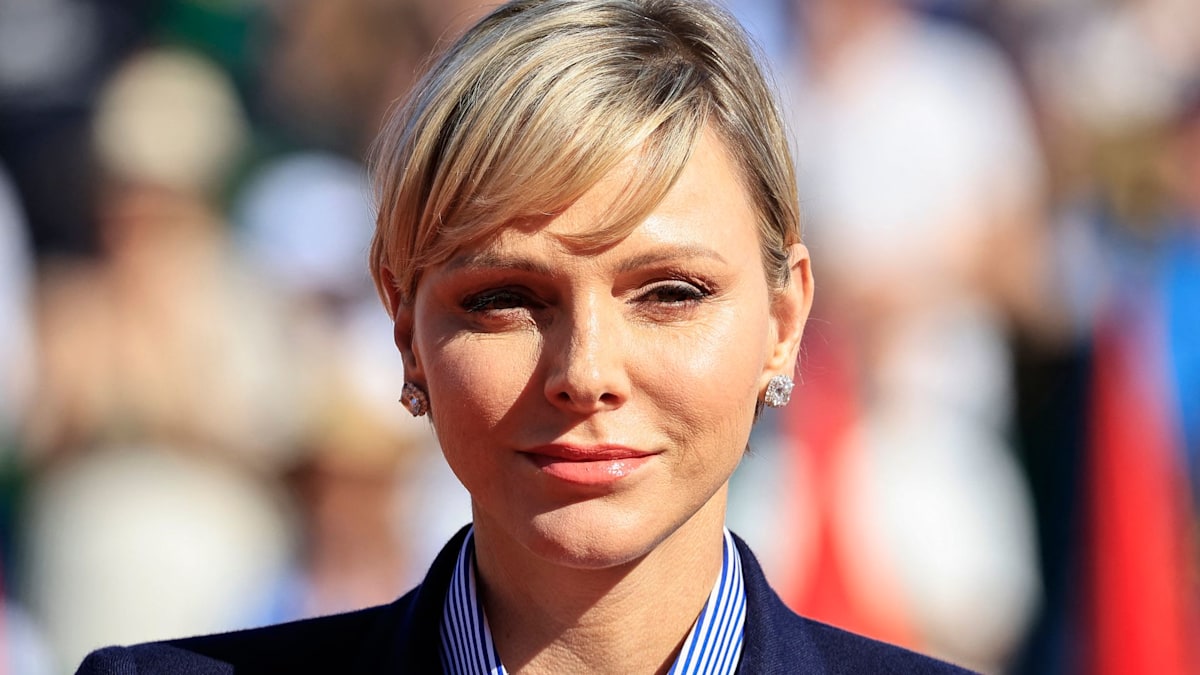 Princess Charlene models white skinny jeans and sweeping blonde hair ...