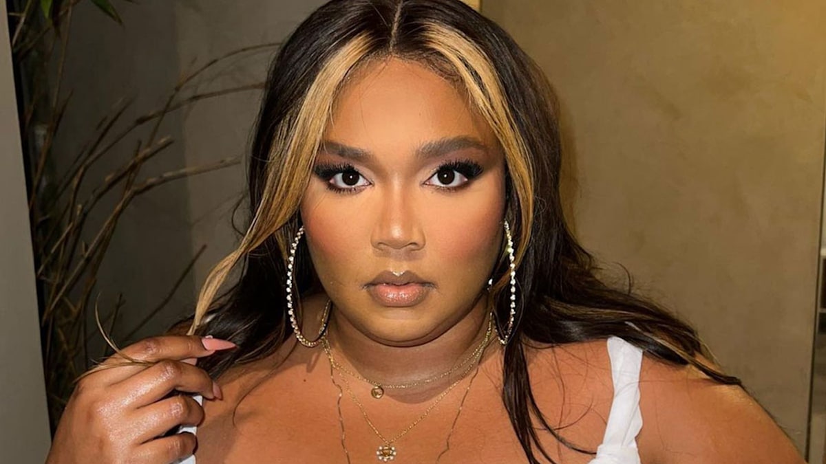 Lizzo displays phenomenal curves in tiny string bikini on beach ...