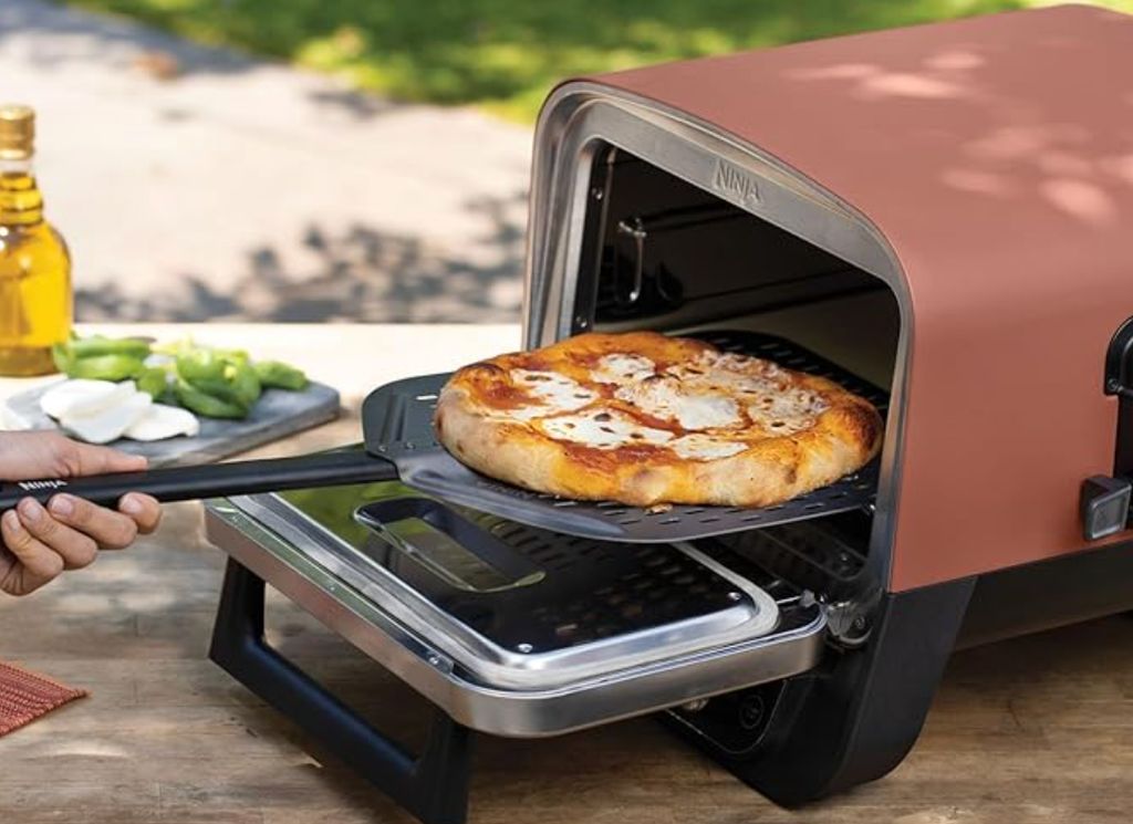 There's major discounts on David Beckham's favourite pizza oven right ...