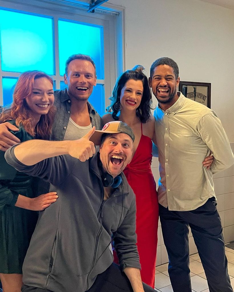 Outlander's Sam Heughan plants a kiss on stunning actress as fans go ...