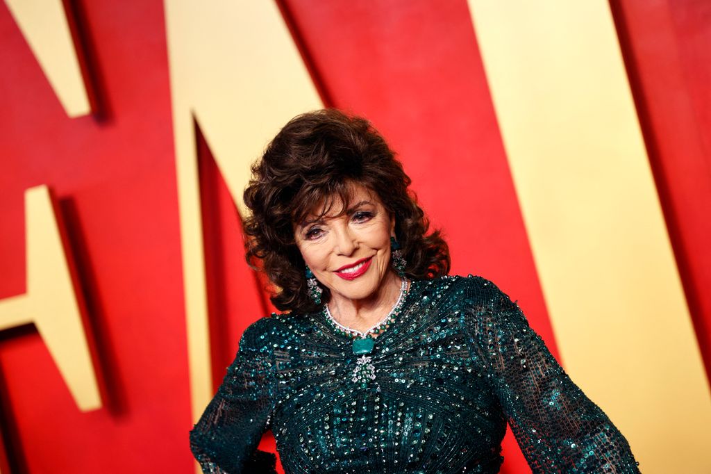 Joan Collins is the ultimate vixen in daring thigh-high split dress ...