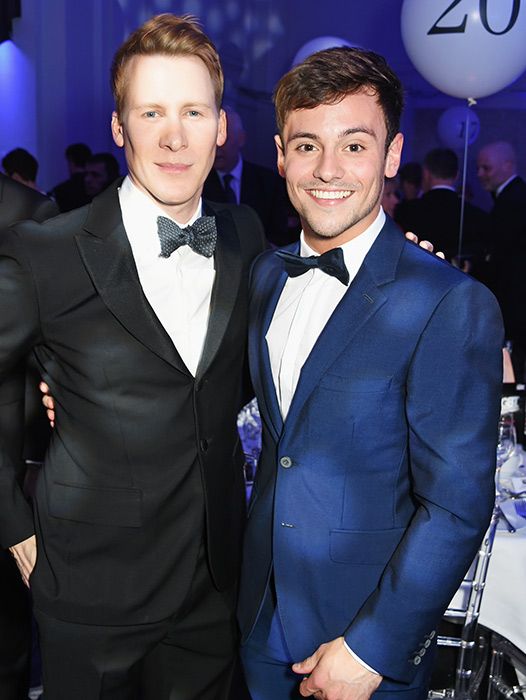 Tom Daley twins with suit-clad husband Dustin and son Robbie in rare ...
