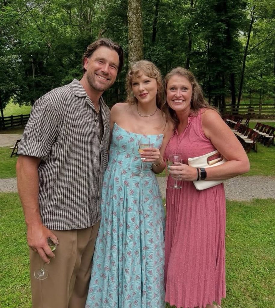 Taylor Swift is the ultimate wedding guest in floral gown alongside ...