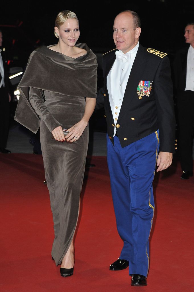 Princess Charlene turns heads in waist-cinching suit with curliest hair ...