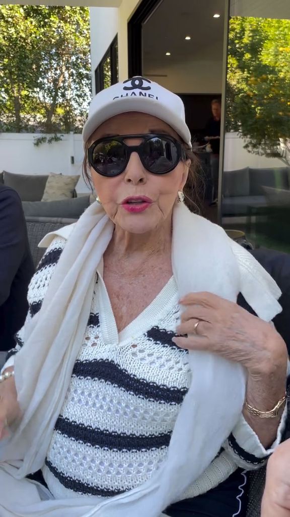 Joan Collins, 91, looks so chic in deep-V top and edgy accessories | HELLO!