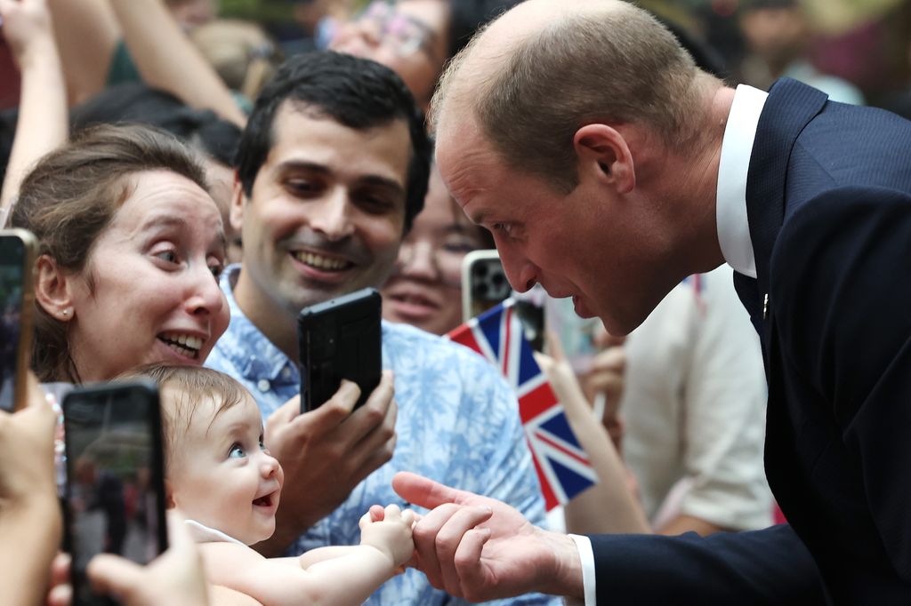 Watch Prince William's reaction as baby bites his finger during royal ...