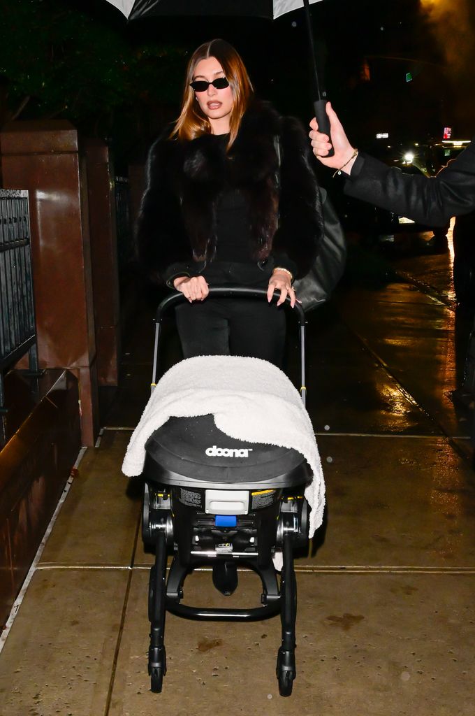 Hailey Bieber nails stroller-chic in dramatically fluffy coat during ...