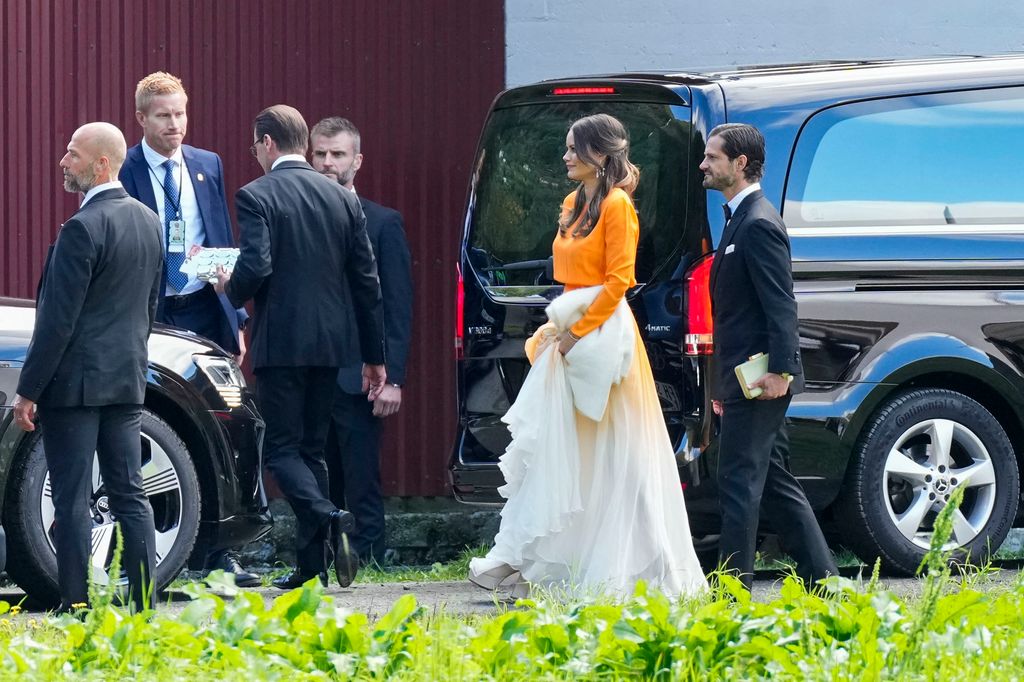 Princess Sofia models rebellious white silky wedding guest dress and ...