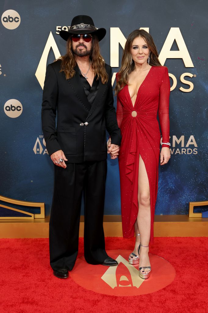 Elizabeth Hurley turns heads in dangerously low dress alongside Billy ...