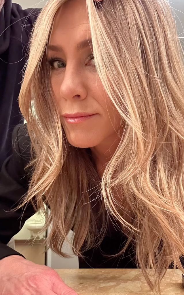 Jennifer Aniston wows in feathers and sequins for candid NYE post | HELLO!