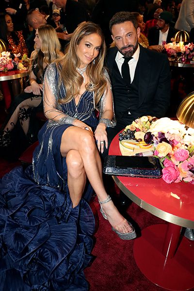 Jennifer Lopez exposes decorated chest and endless legs for Grammys ...