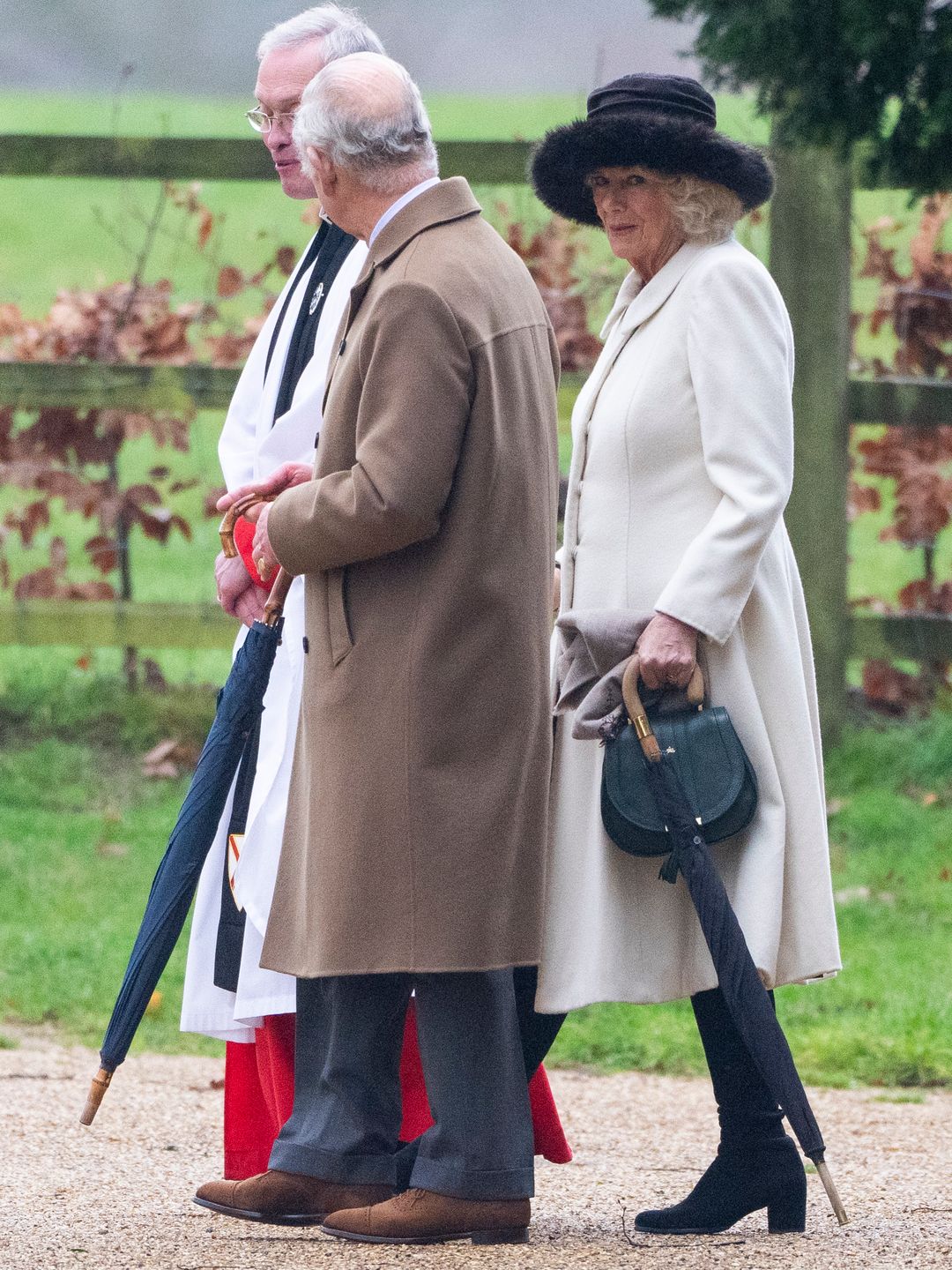 Queen Camilla twins with Meghan Markle in identical handbags | HELLO!