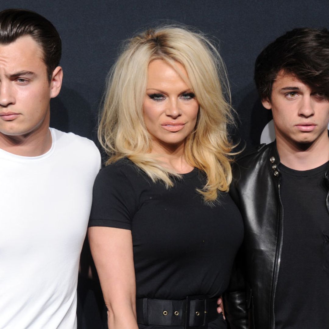 Pamela Anderson is a goddess in all white knit dress as she steps out ...