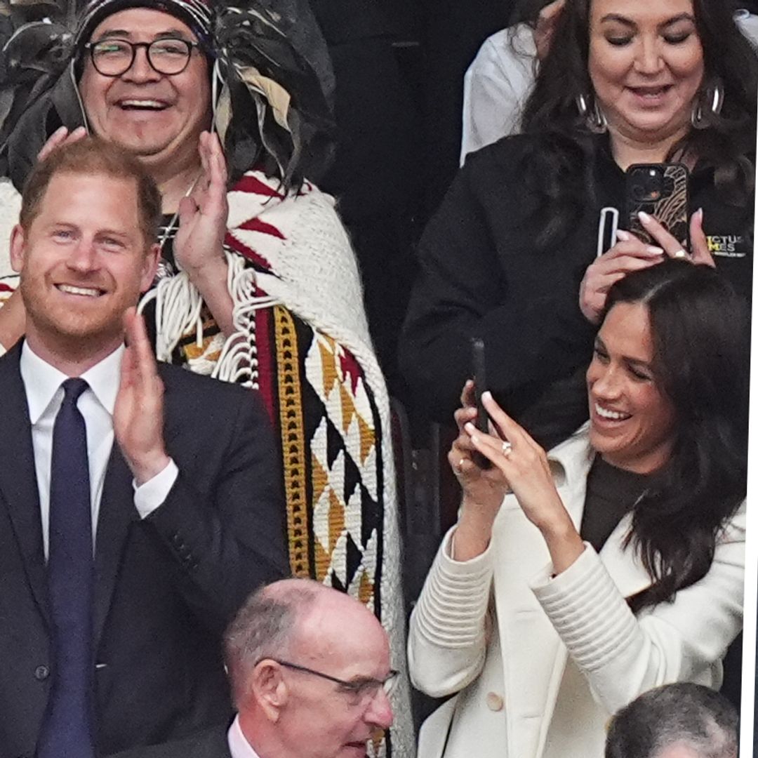 Meghan Markle gives husband Prince Harry a passionate kiss on stage as Invictus Games begins ...