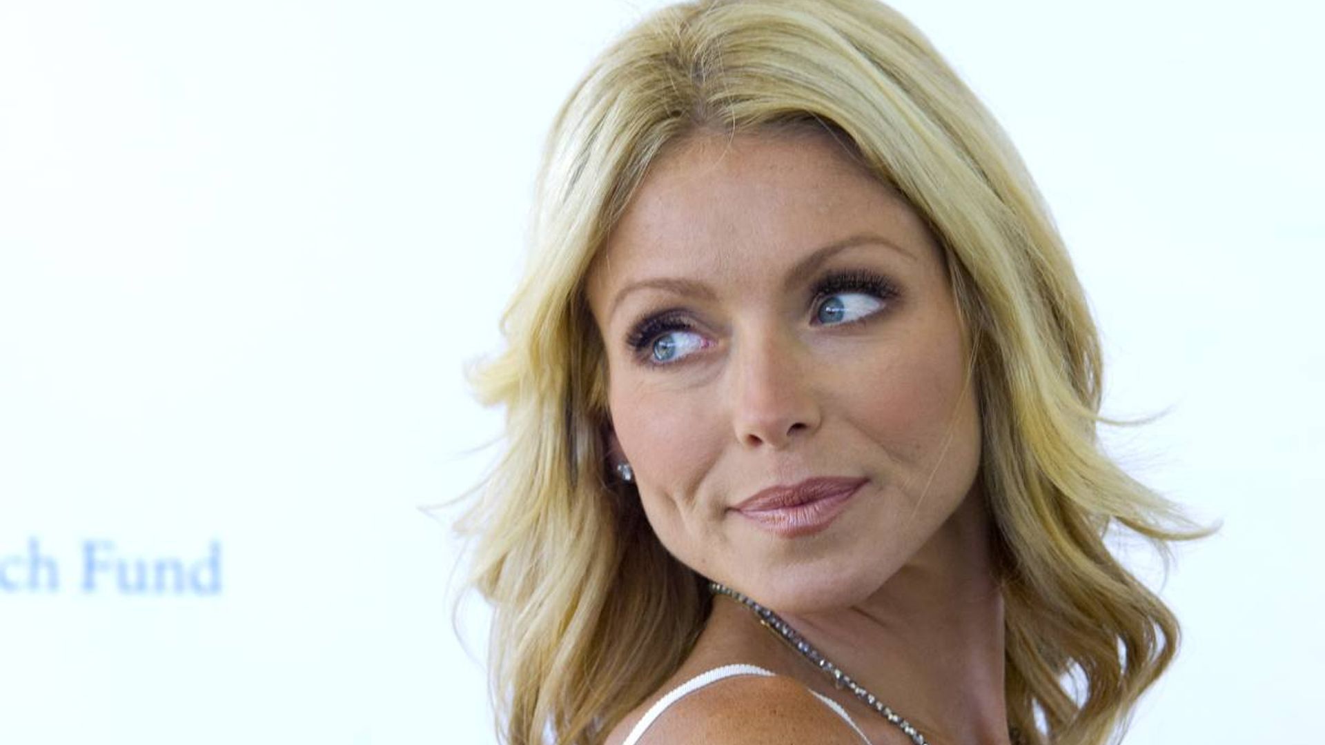 Kelly Ripa has long hair and bangs and is wearing a leotard in latest ...