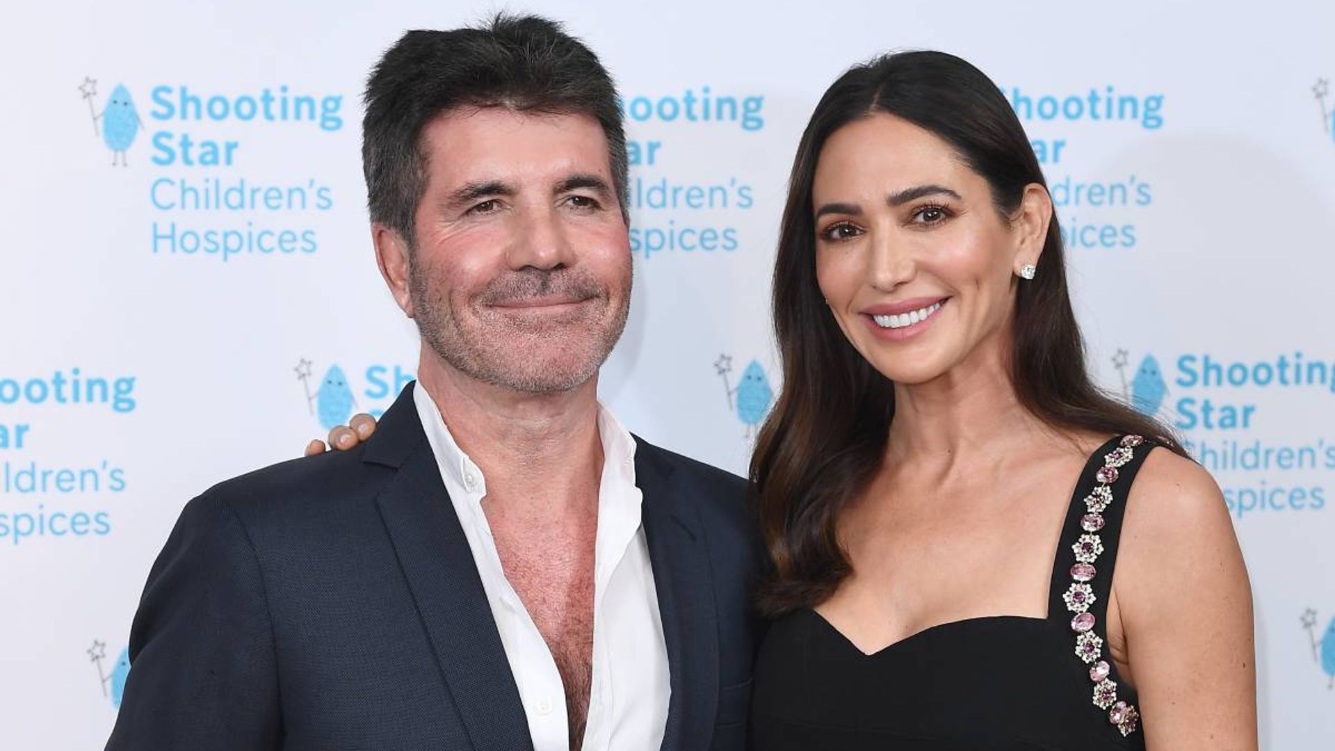 AGT's Simon Cowell pictured in rare PDA moment with fiancée Lauren ...