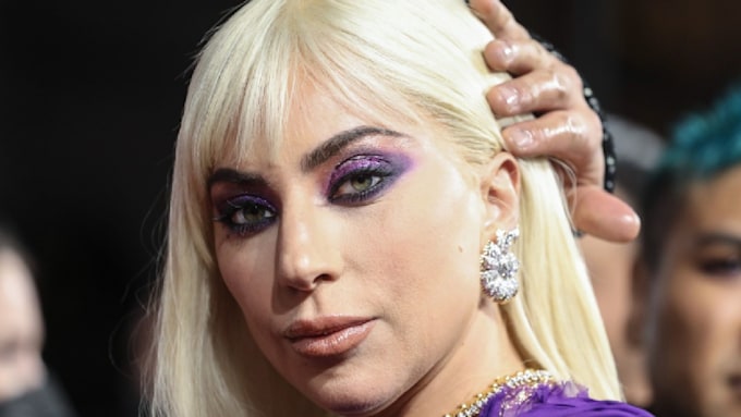 Lady Gaga wows in figure-hugging metallic dress as she unveils bold new ...
