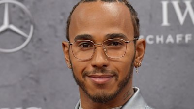 Lewis Hamilton visits street children in The Philippines | HELLO!