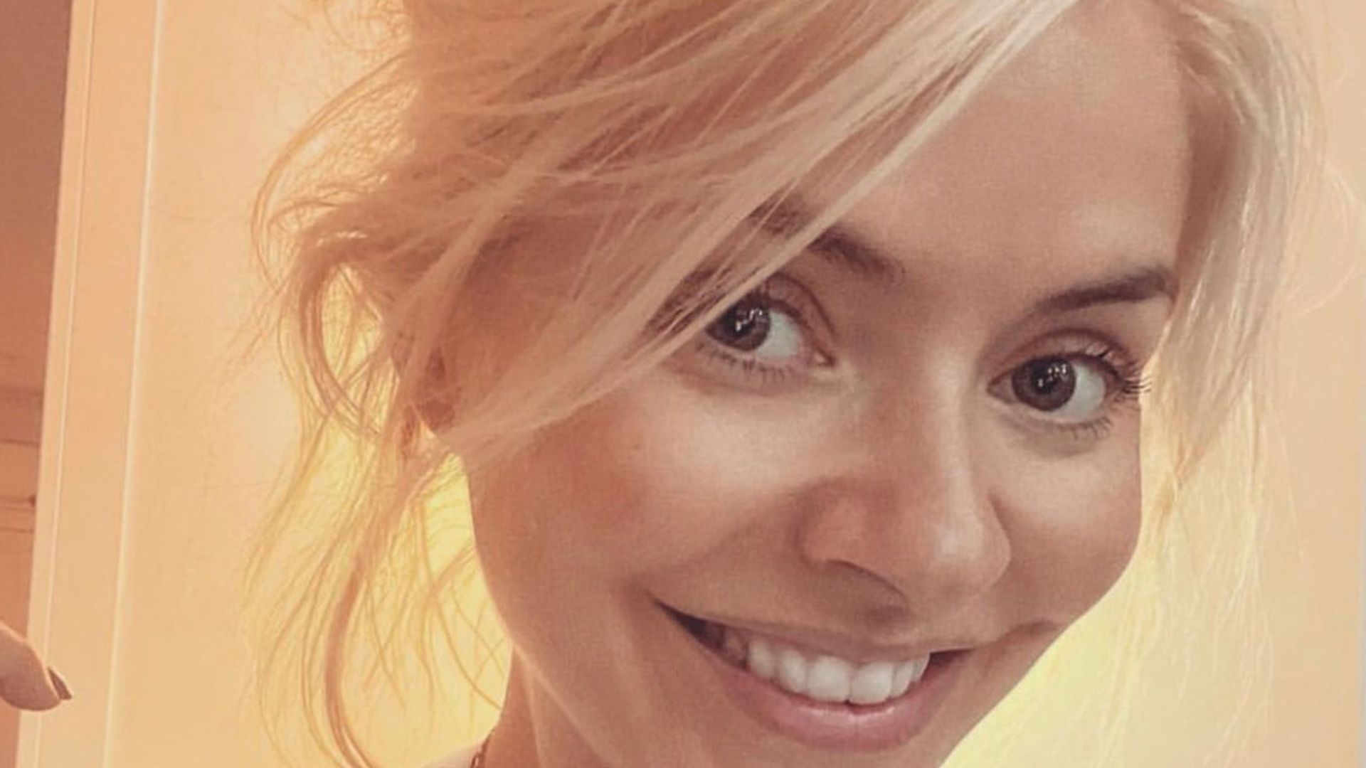 Holly Willoughby shows off her tan as she poses in a towel ahead of ...