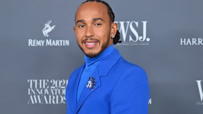 Lewis Hamilton visits street children in The Philippines | HELLO!