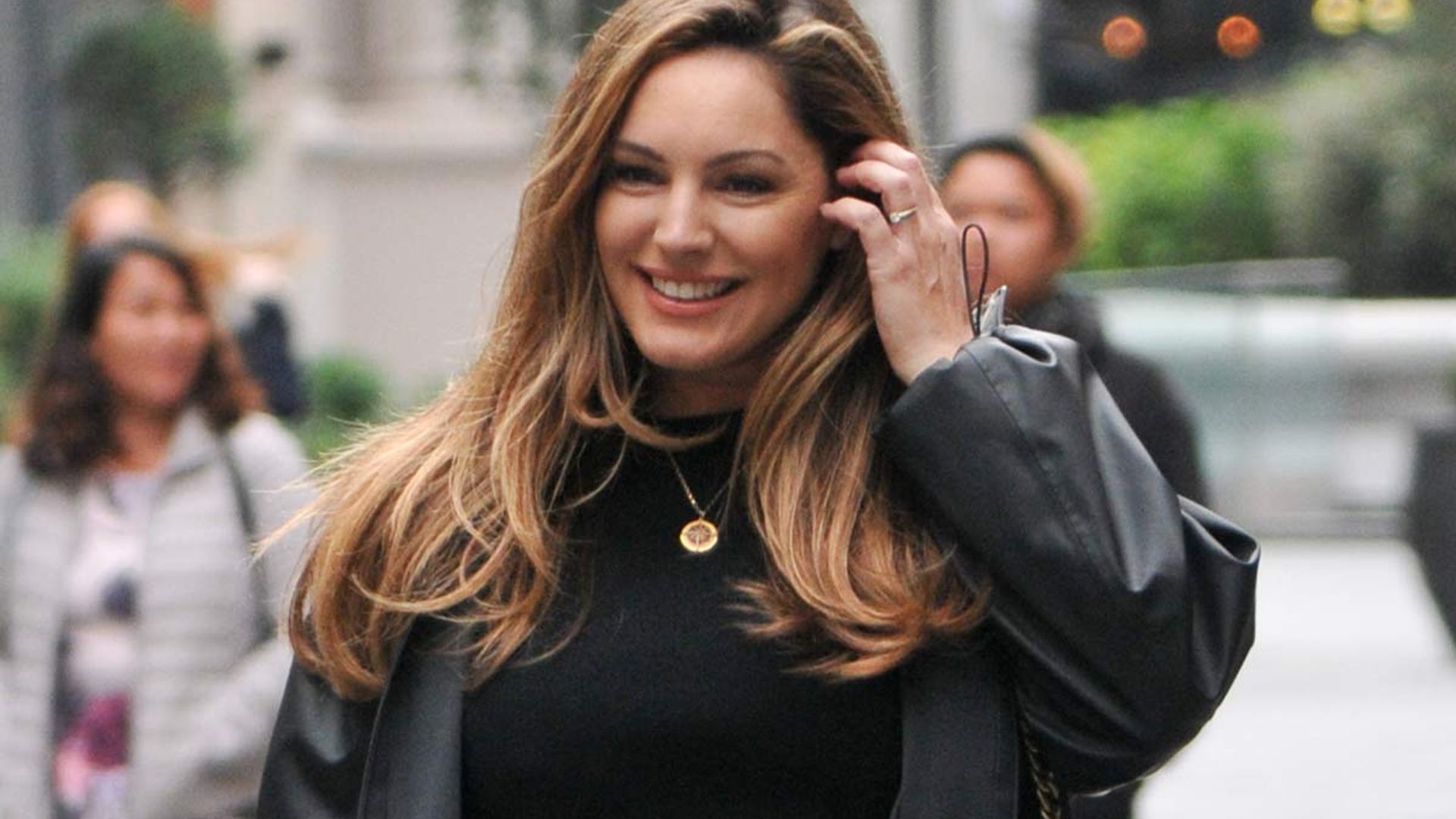 Kelly Brook floors fans in silky satin skirt and SERIOUS arm candy | HELLO!