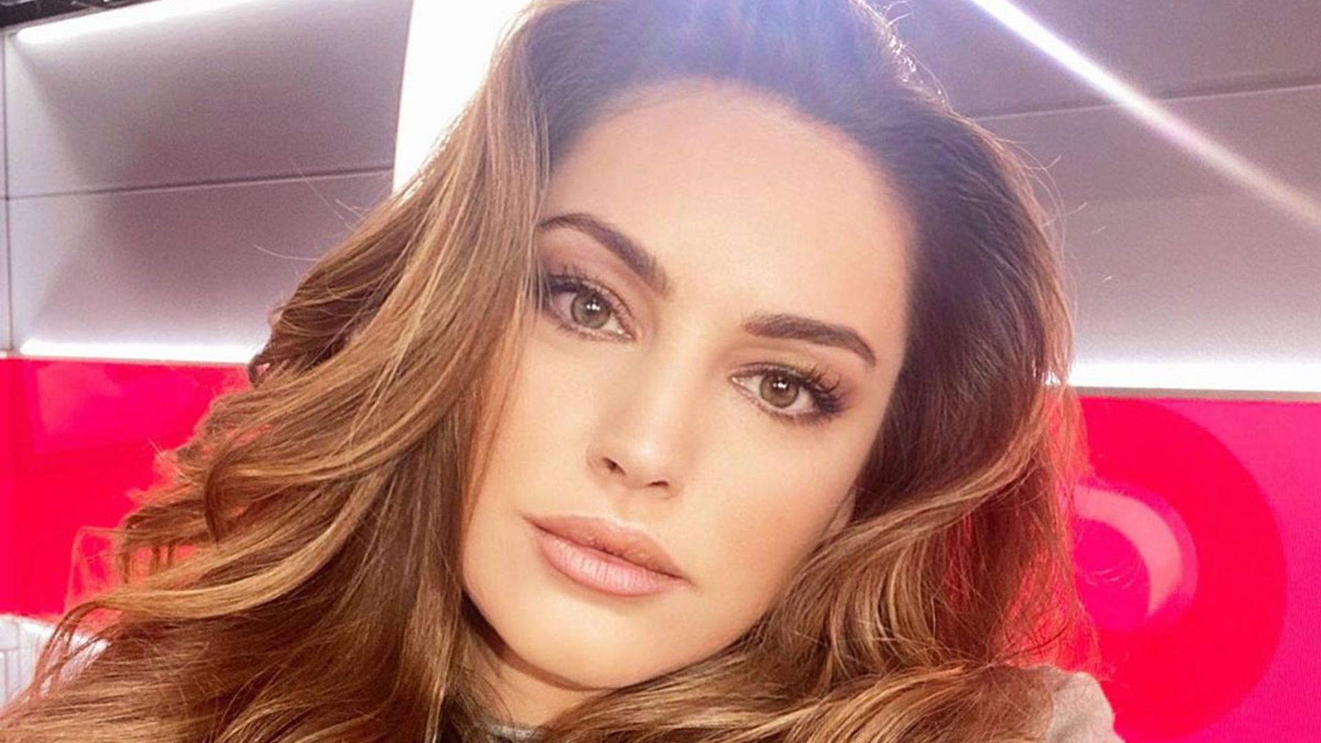 Kelly Brook causes a stir in mini dress and knee-high boots | HELLO!
