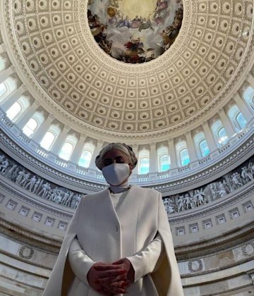 Lady Gaga surprises fans in a Hunger Games-esque dress at Joe Biden’s ...